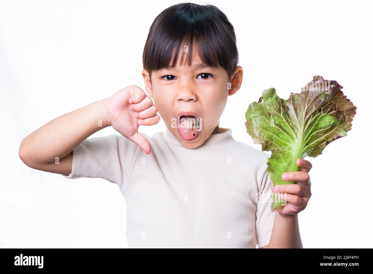 Children do not like to eat vegetables. Little girl who hates eating ...