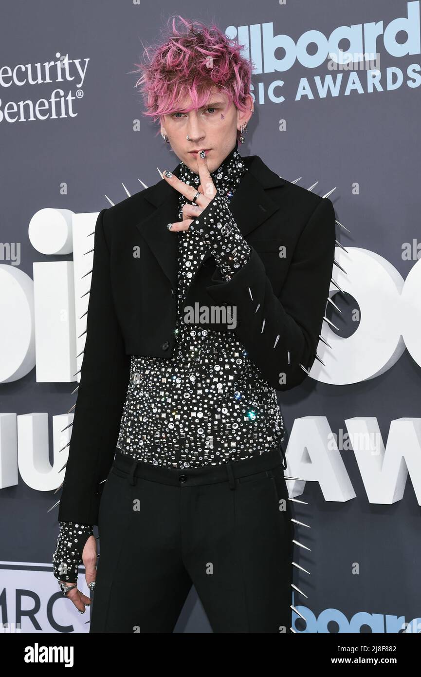 Machine Gun Kelly walking on the red carpet at the 2022 Billboard Music Awards at MGM Grand ...