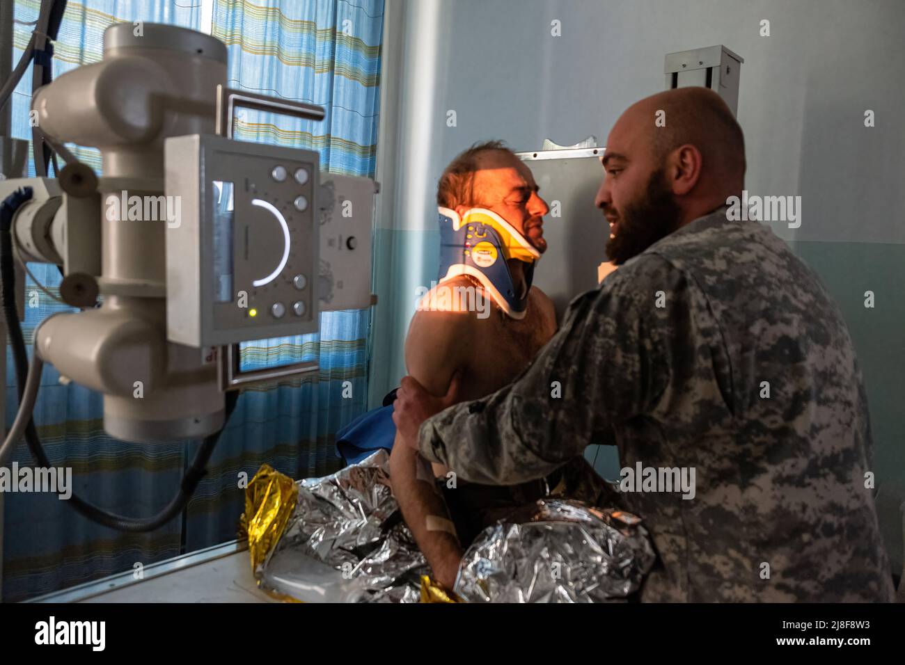 A soldier who suffered concussion and spinal trauma is visited by a ...