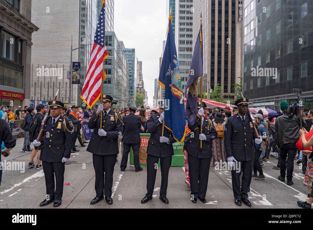 NEW YORK, NEW YORK - MAY 15: NYPD flag squad marches up Sixth Avenue ...