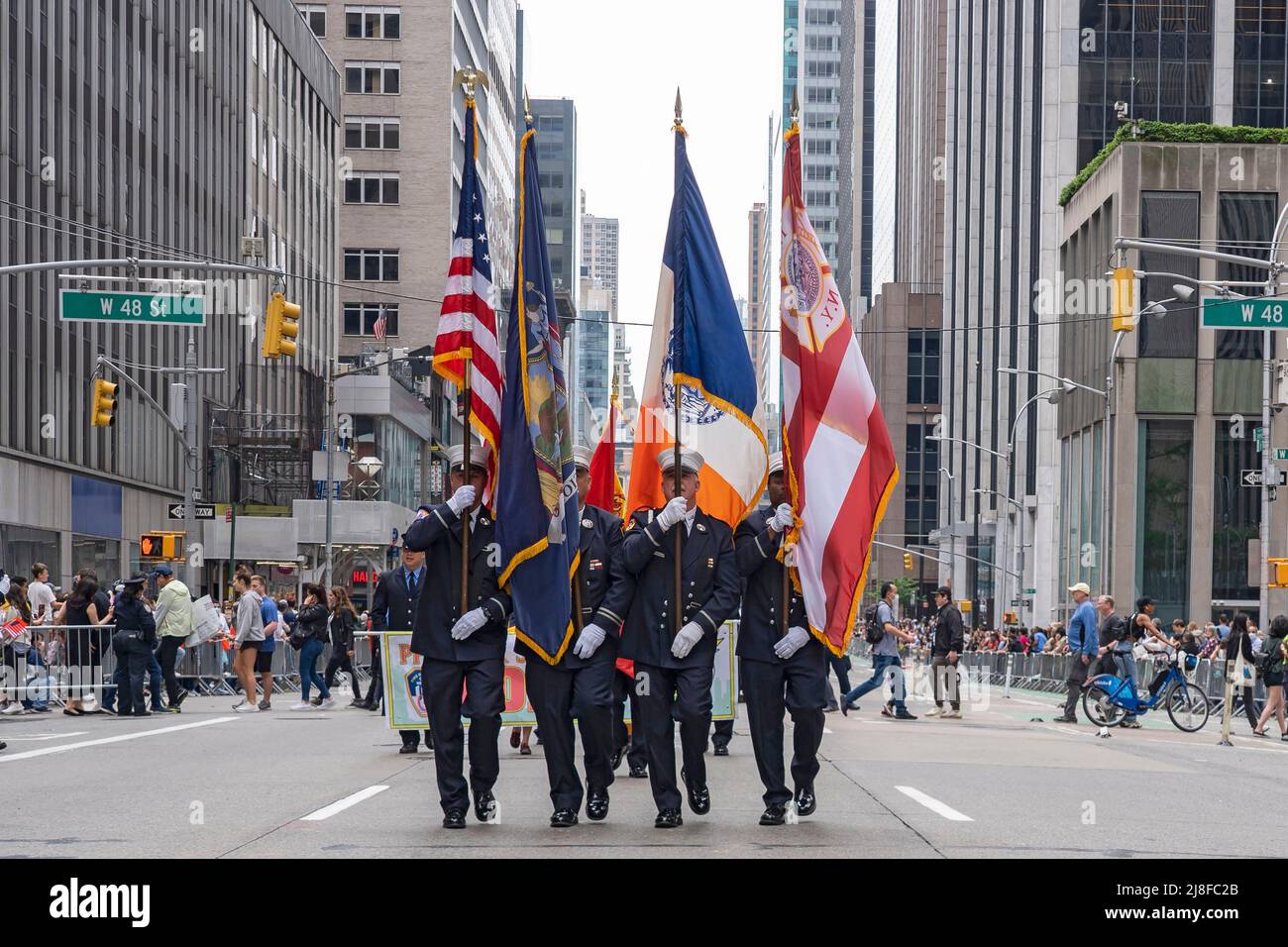 NEW YORK, NEW YORK - MAY 15: FDNY flag squad marches up Sixth Avenue ...