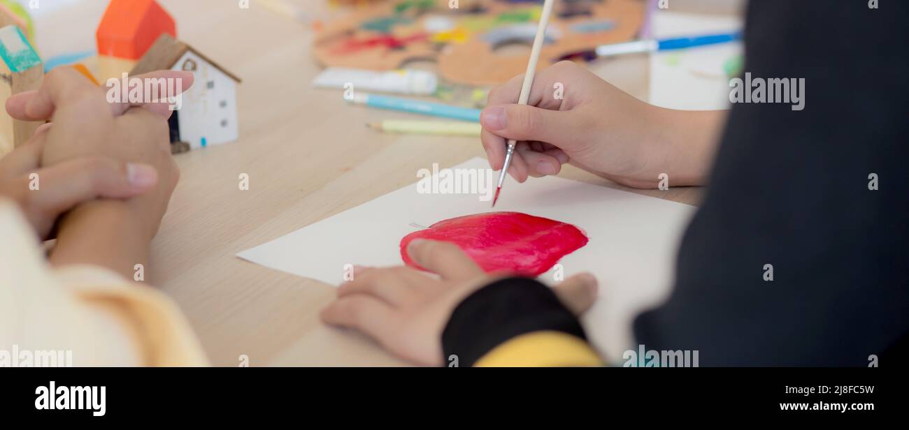 Closeup group of student sitting and studying and learning drawing with ...