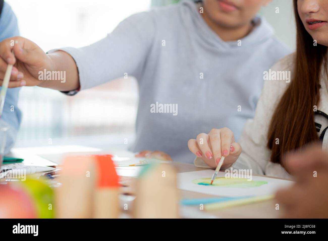 Closeup group of student sitting and studying and learning drawing with ...