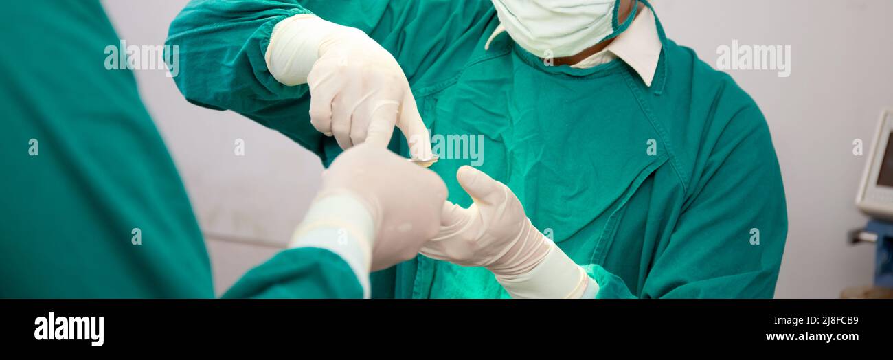 Group of team doctor and surgeon doing surgery with patient in the ...