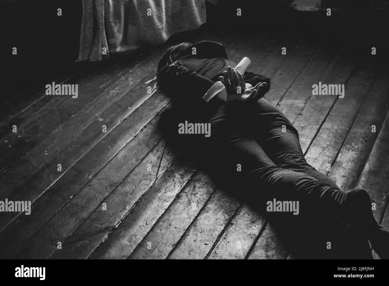 A dead Ukrainian woman lies in an apartment with her hands tied with a ...