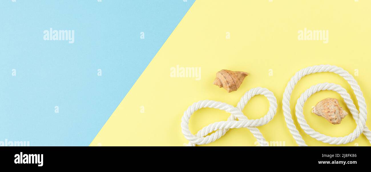 Rope with seashells. Marine theme Stock Photo - Alamy