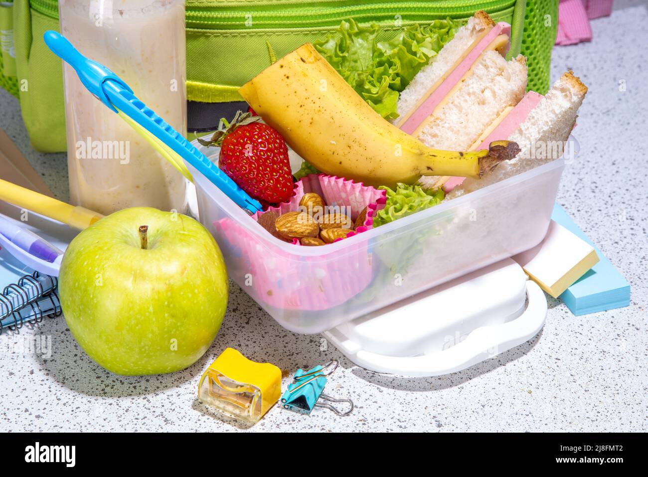 Healthy school lunch box: sandwich, vegetables, fruit, nuts and yogurt ...