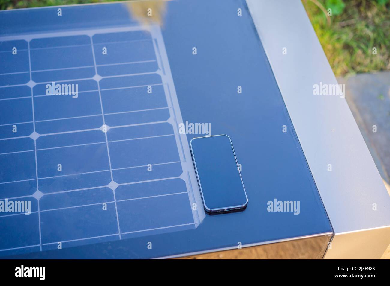 New smart bench in local public park used for charging mobile phones ...