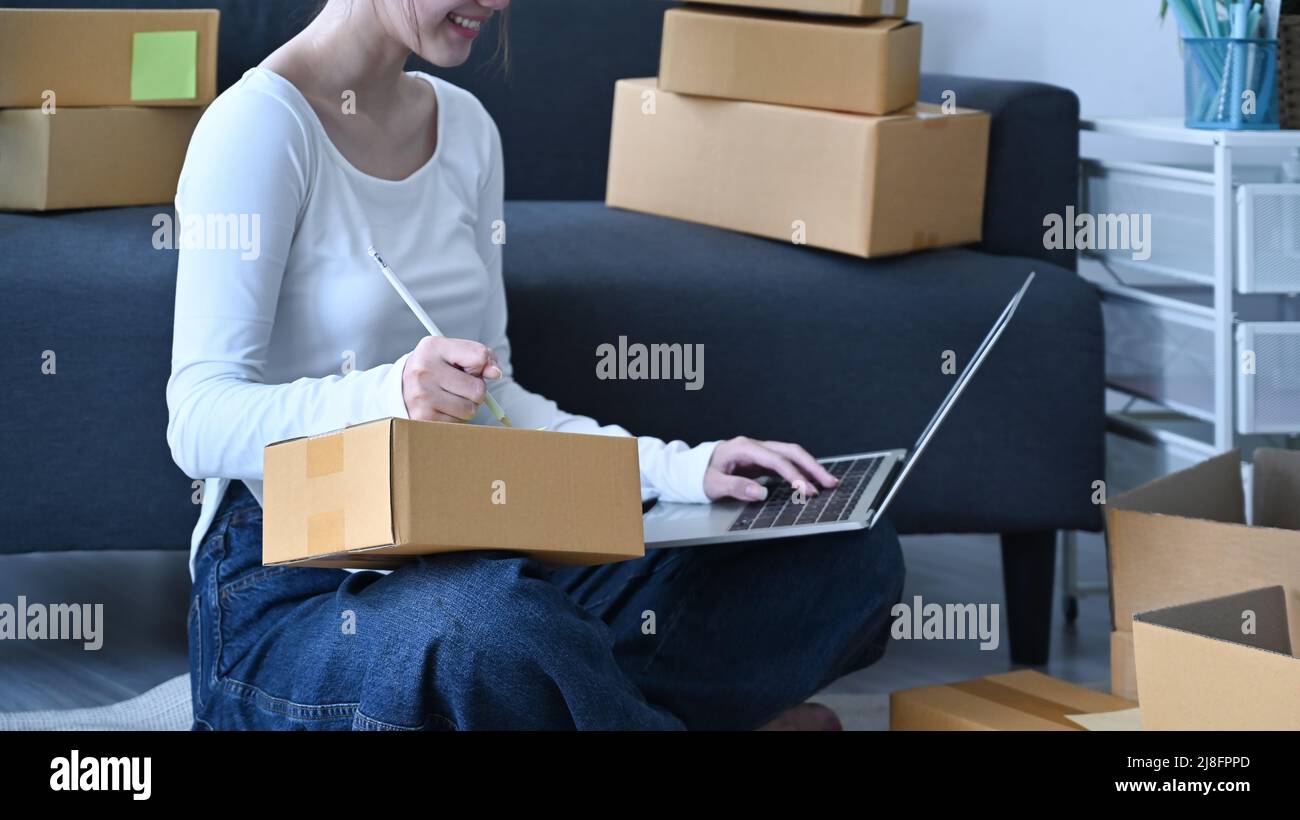 Start up small business entrepreneur confirming orders from customer on ...