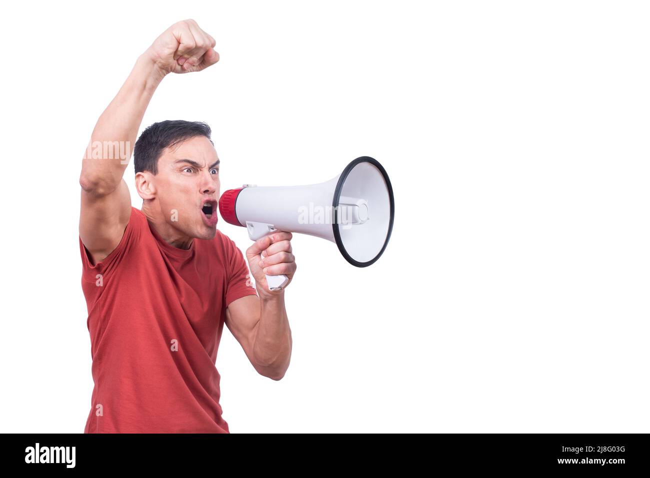 Expressive male screaming with loudspeaker in studio Stock Photo - Alamy