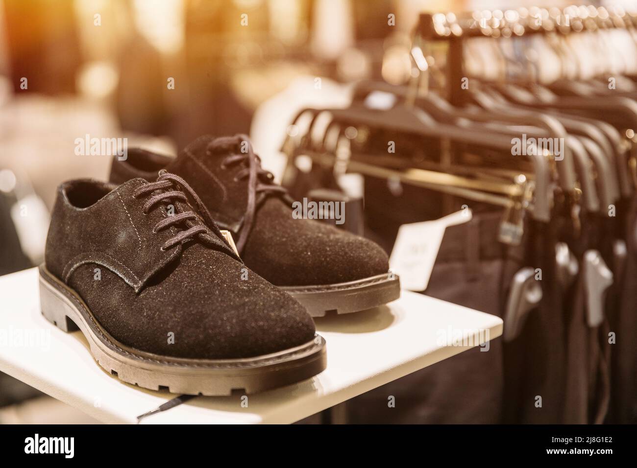 black chamois unisex shoes on shelf display in shop mall store. Store ...