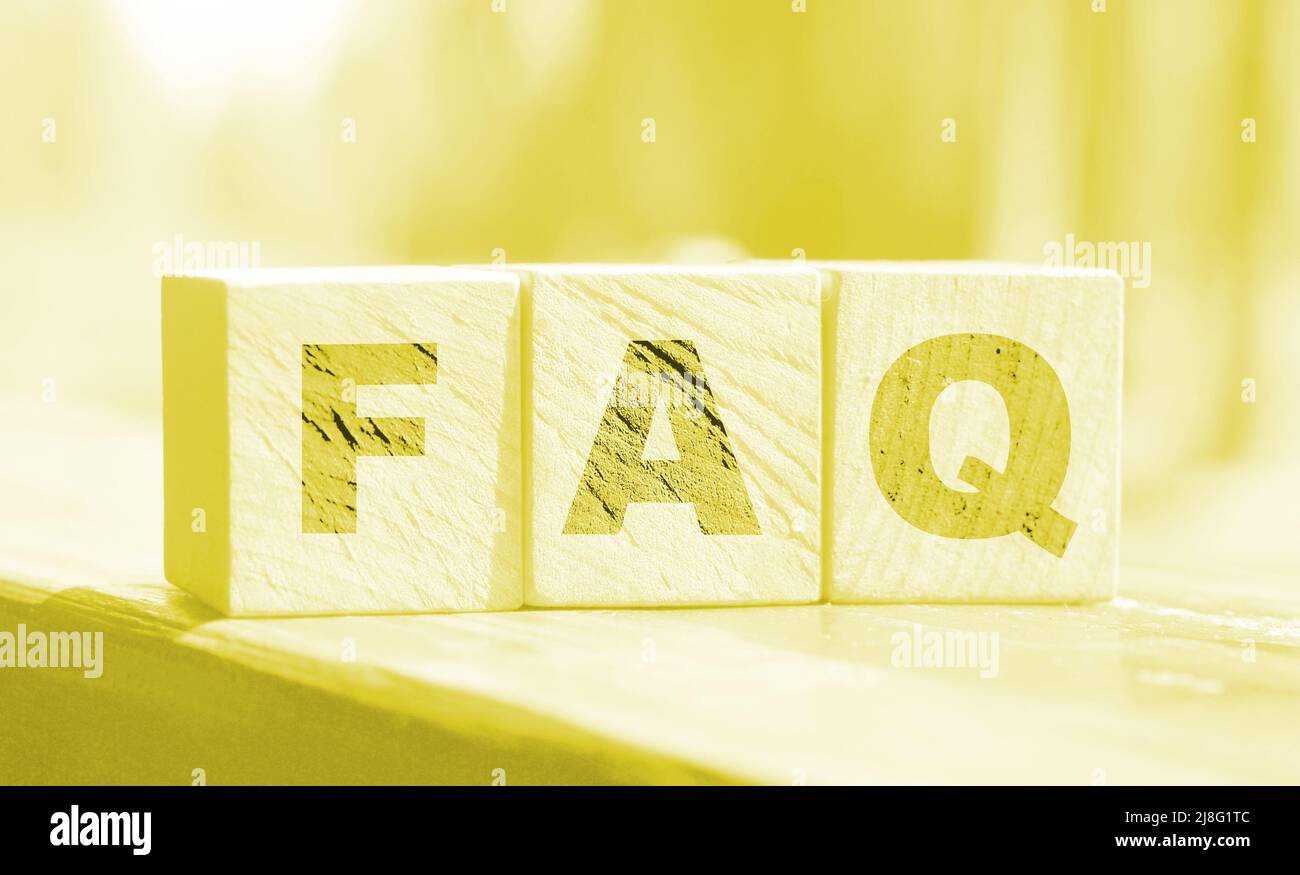 FAQ sign made of wooden cubes on table outdoors Stock Photo - Alamy