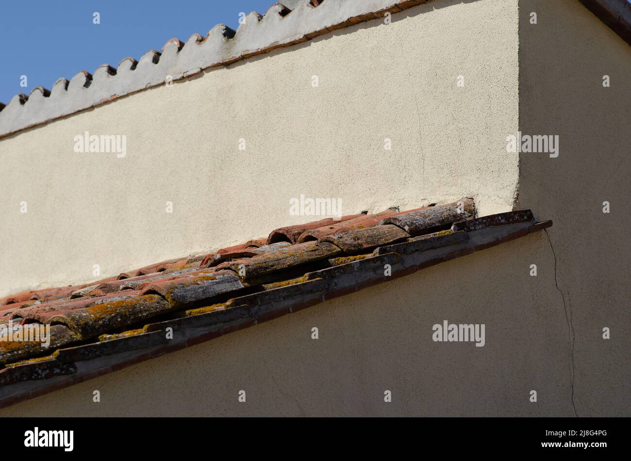 House: pitched roofs with brick tiles, exposed upper ridge and ridge ...