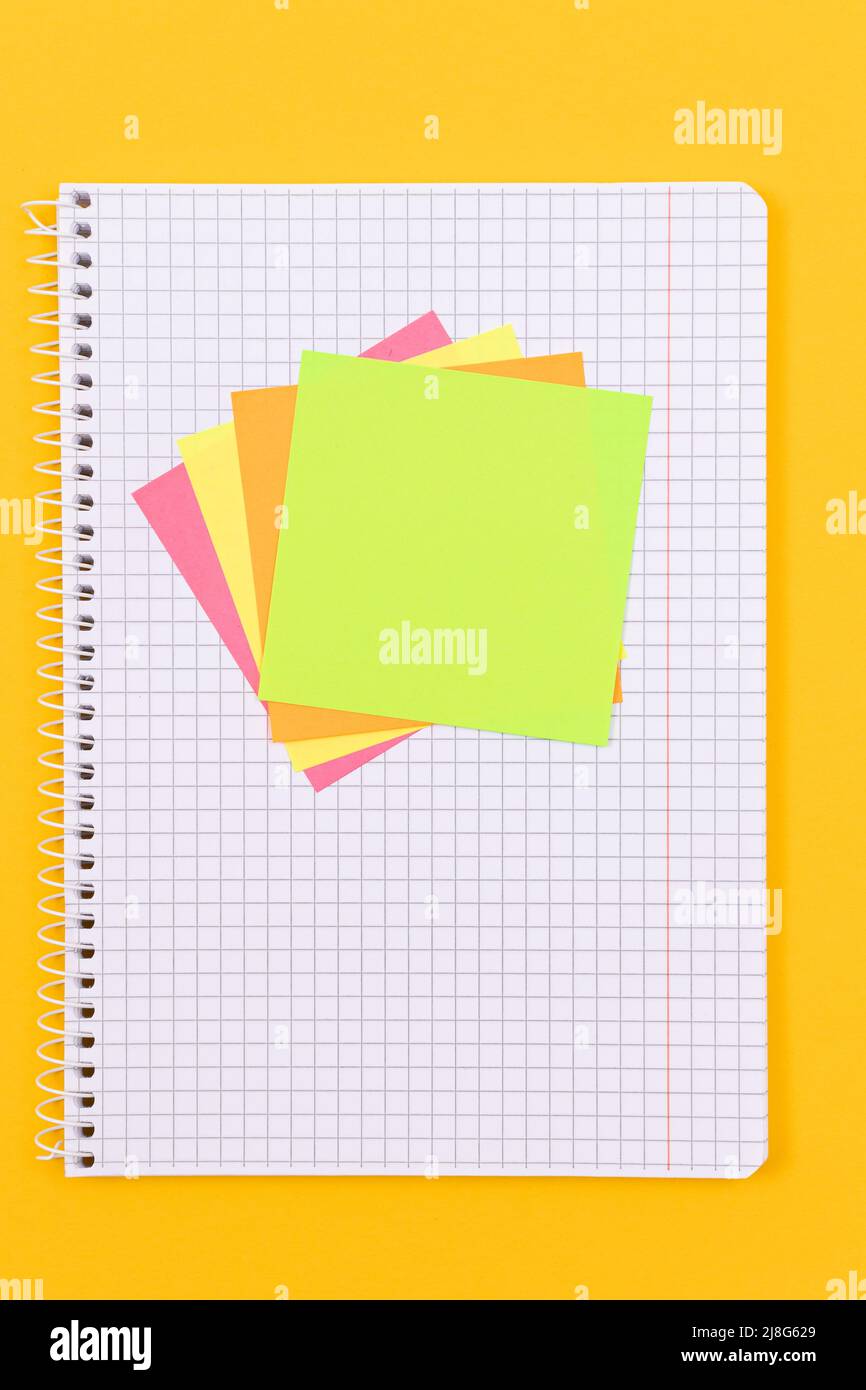 A Notepad with Sticky Notes Lying on Yellow Table - Blank Template. Top ...