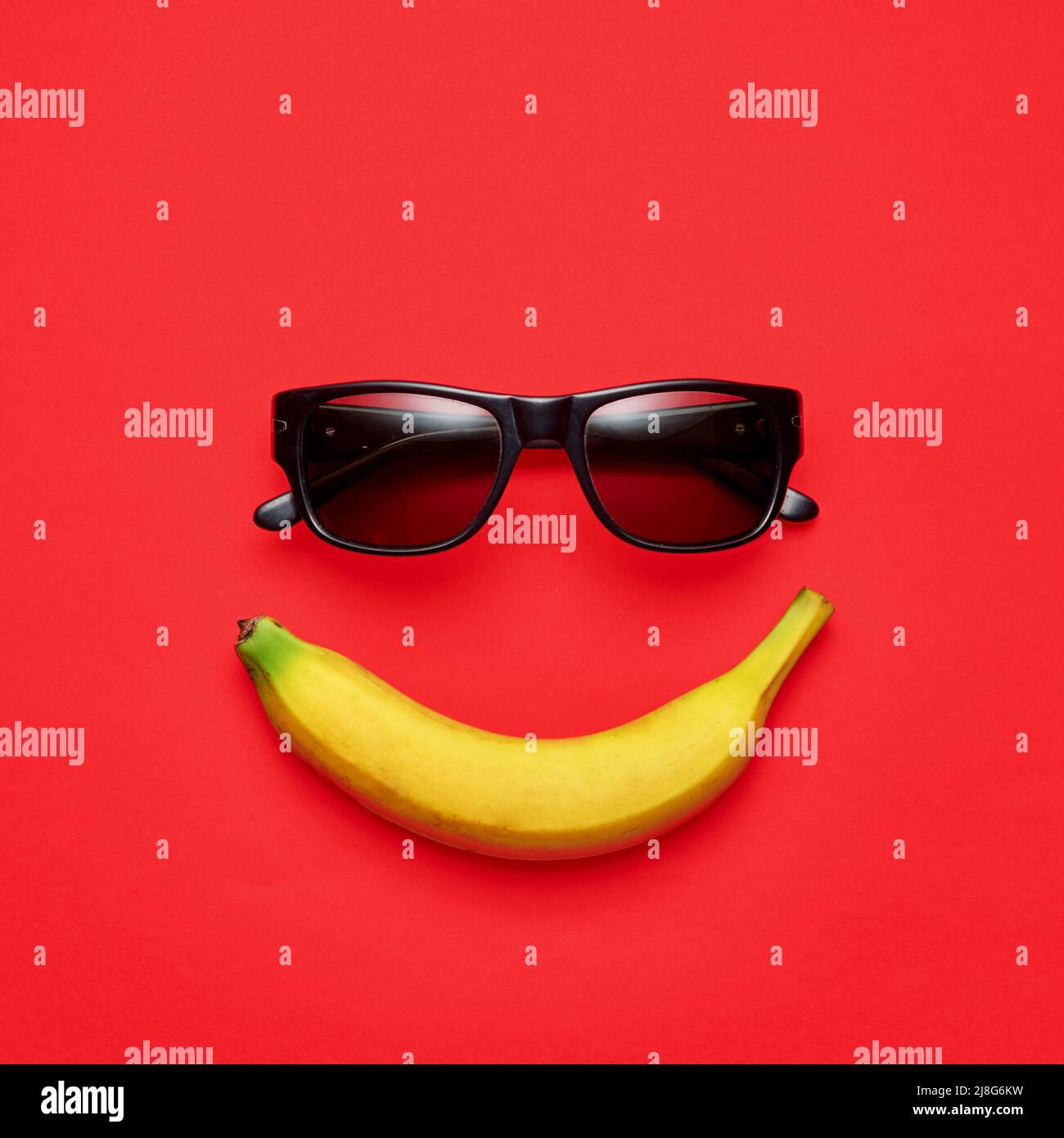 Funny smiling happy face with sunglasses and banana. Summer holiday and ...