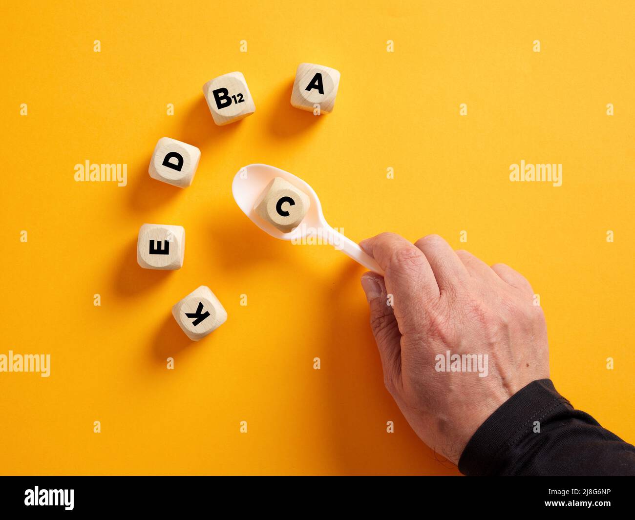 Healthy nutrition, dieting and vitamin intake concept. Hand holding a ...