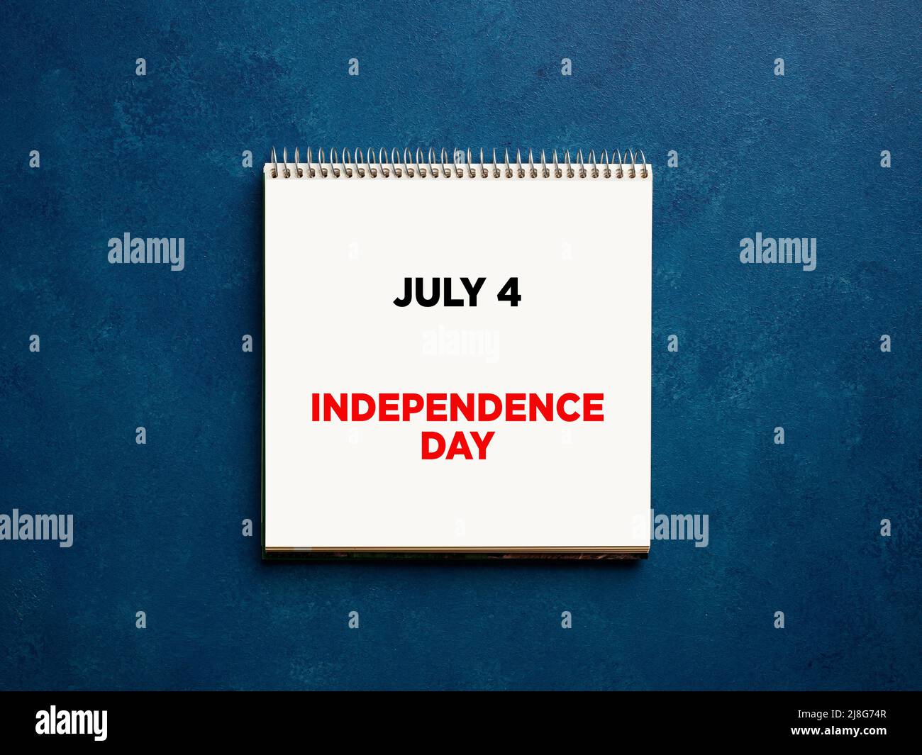 The reminder fourth of July independence day written on a notebook ...