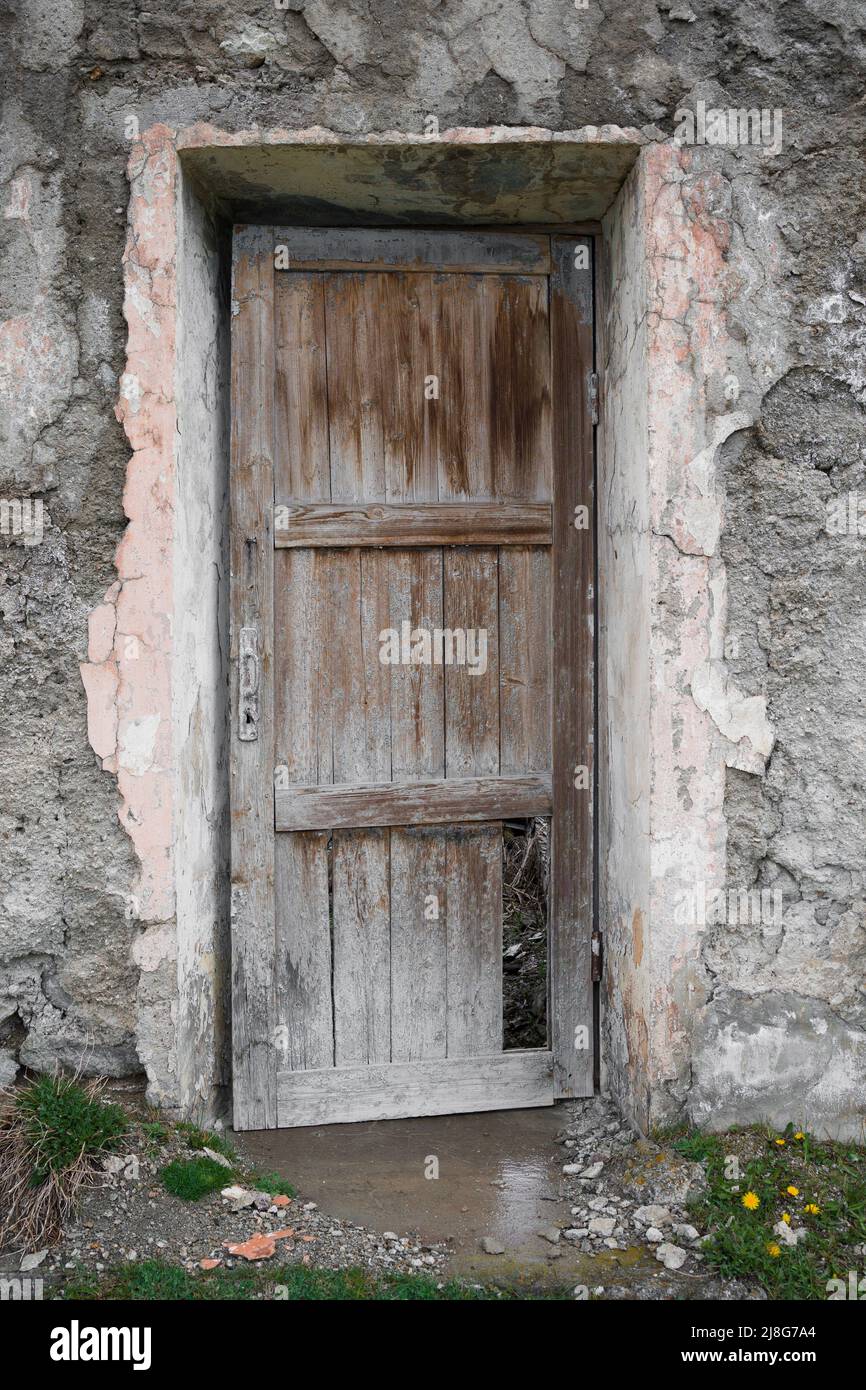 ancient abandoned ruins mud and wooden door of old house Stock Photo ...
