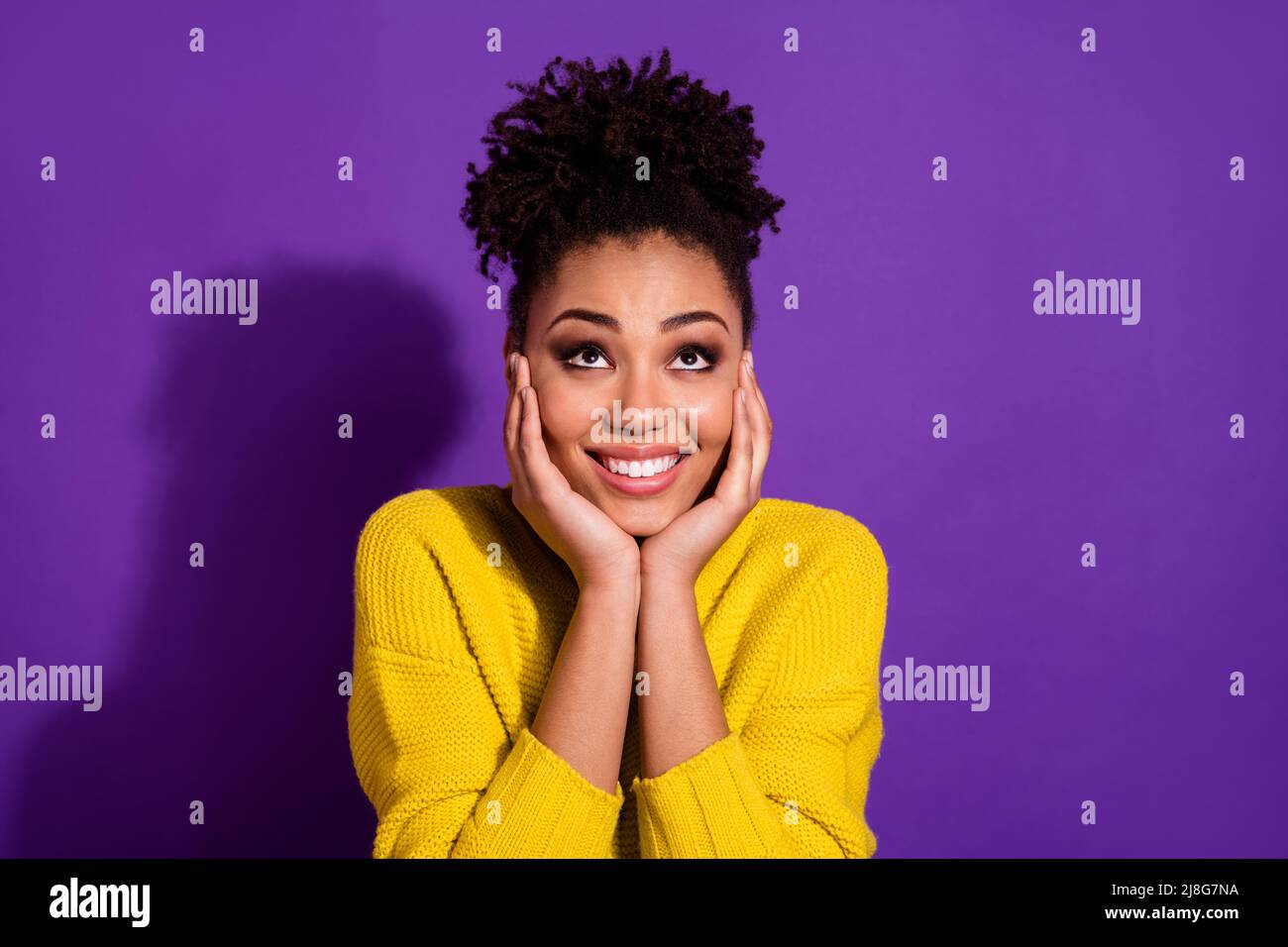 Portrait of pretty positive person hands touch cheeks look up empty ...