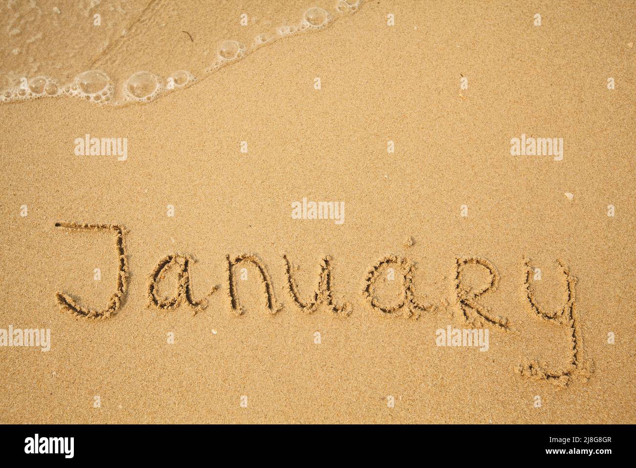 January - drawing handwritten on the sea beach sand Stock Photo - Alamy