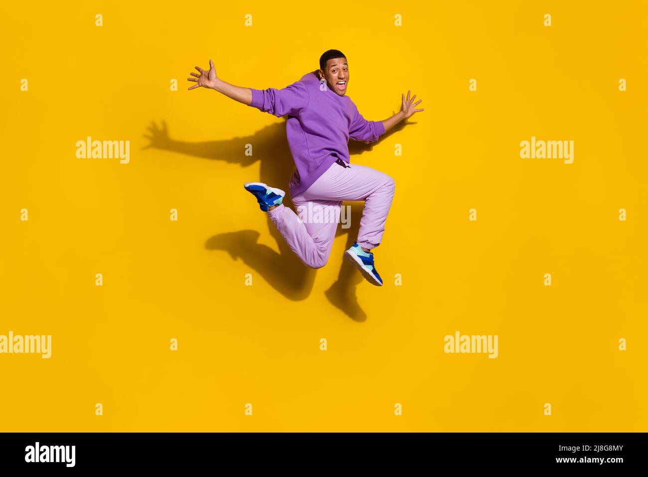 Full length body size view of attractive trendy cheerful guy jumping ...