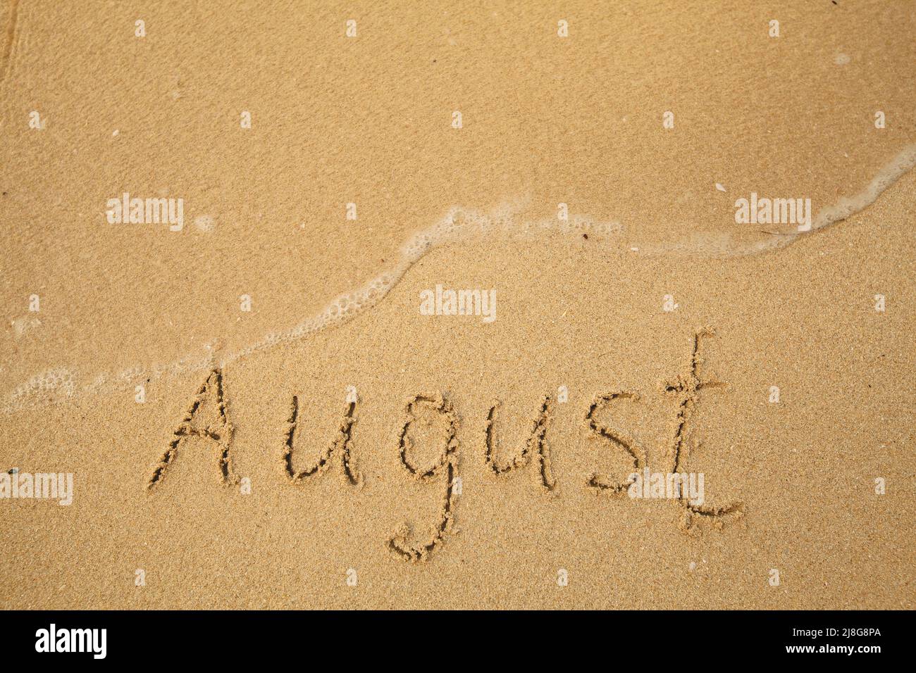 August - drawing handwritten on the sea beach sand Stock Photo - Alamy