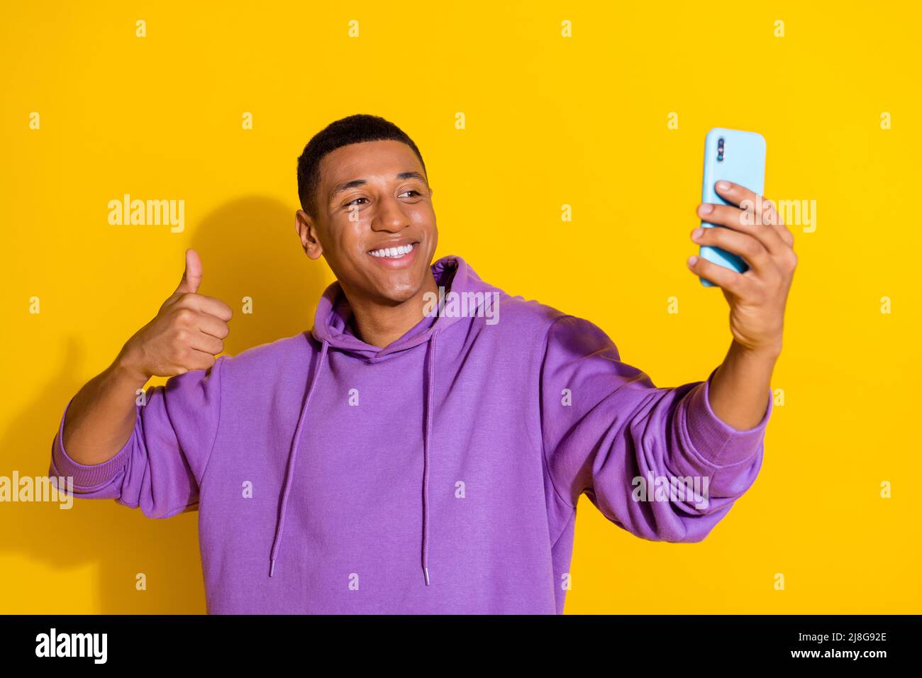 Portrait of handsome trendy cheerful guy taking making selfie showing ...