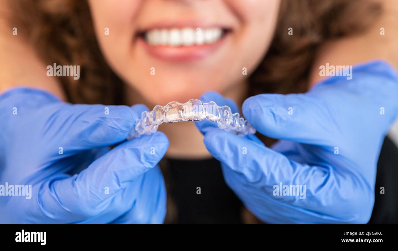Woman using aligner hi-res stock photography and images - Alamy