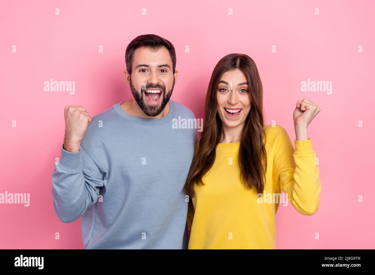 Portrait of attractive cheerful lucky couple rejoicing having fun ...