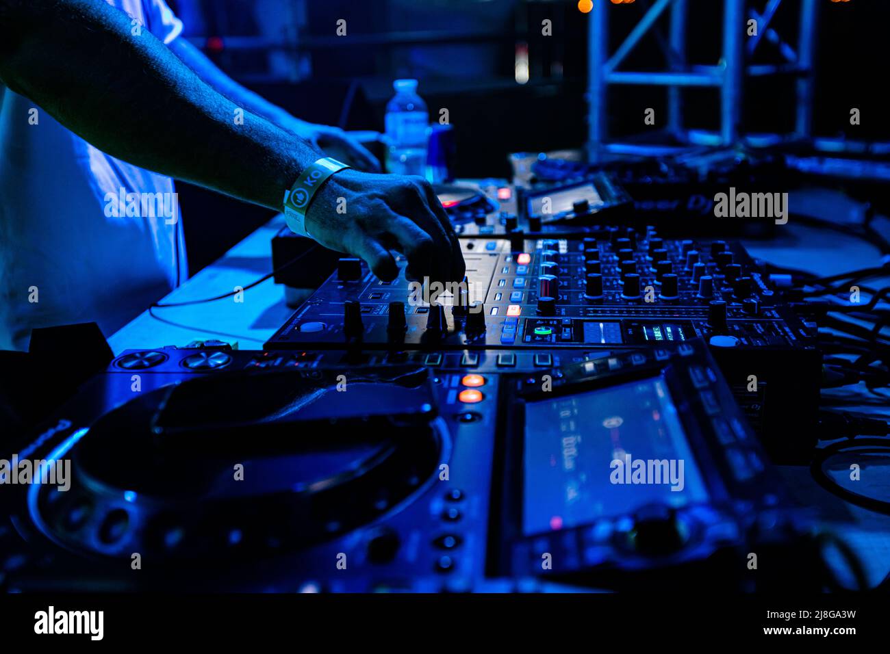 DJ hand on mixing equipment at night club Stock Photo - Alamy