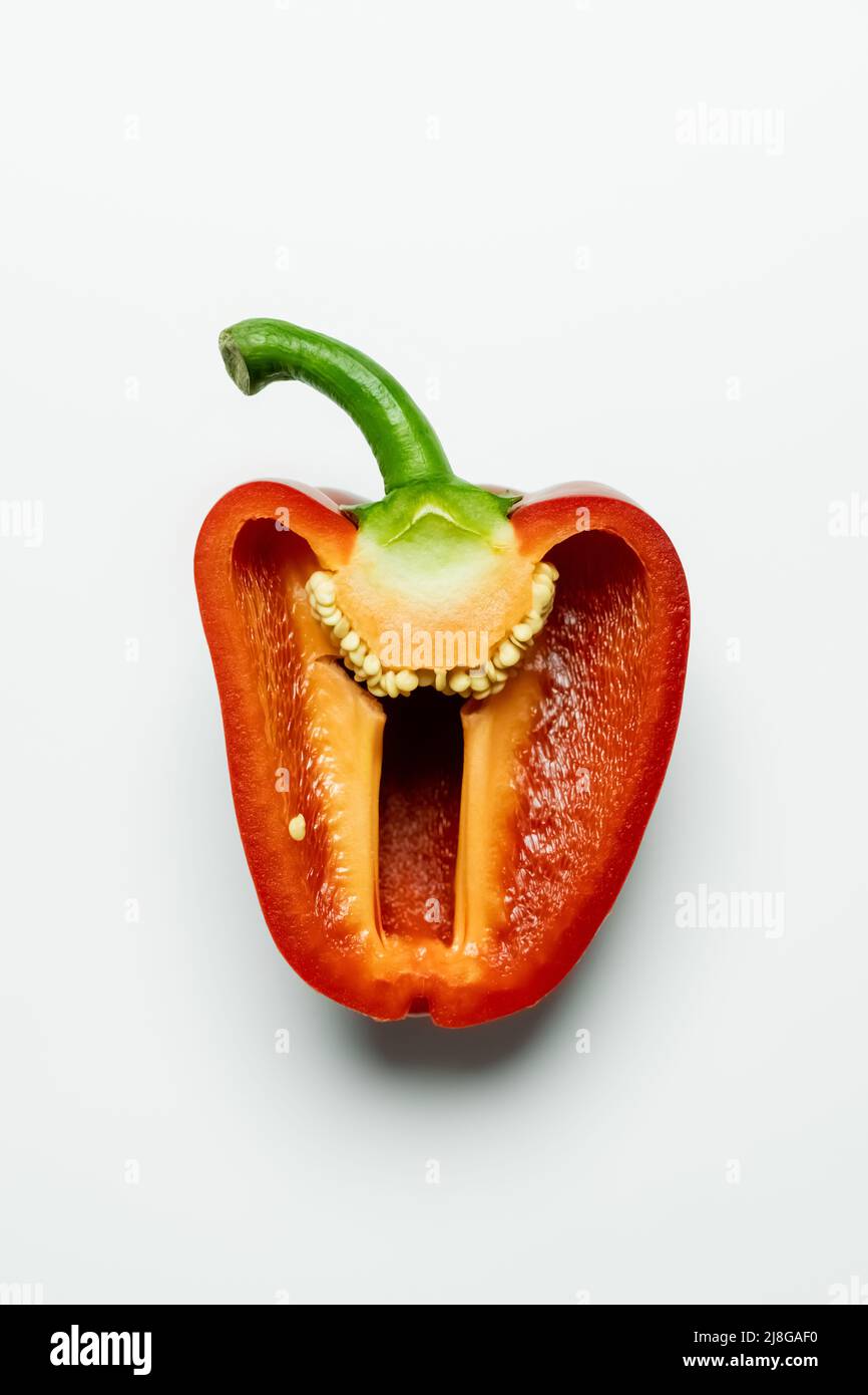 Top view of red cut bell pepper on white background Stock Photo - Alamy