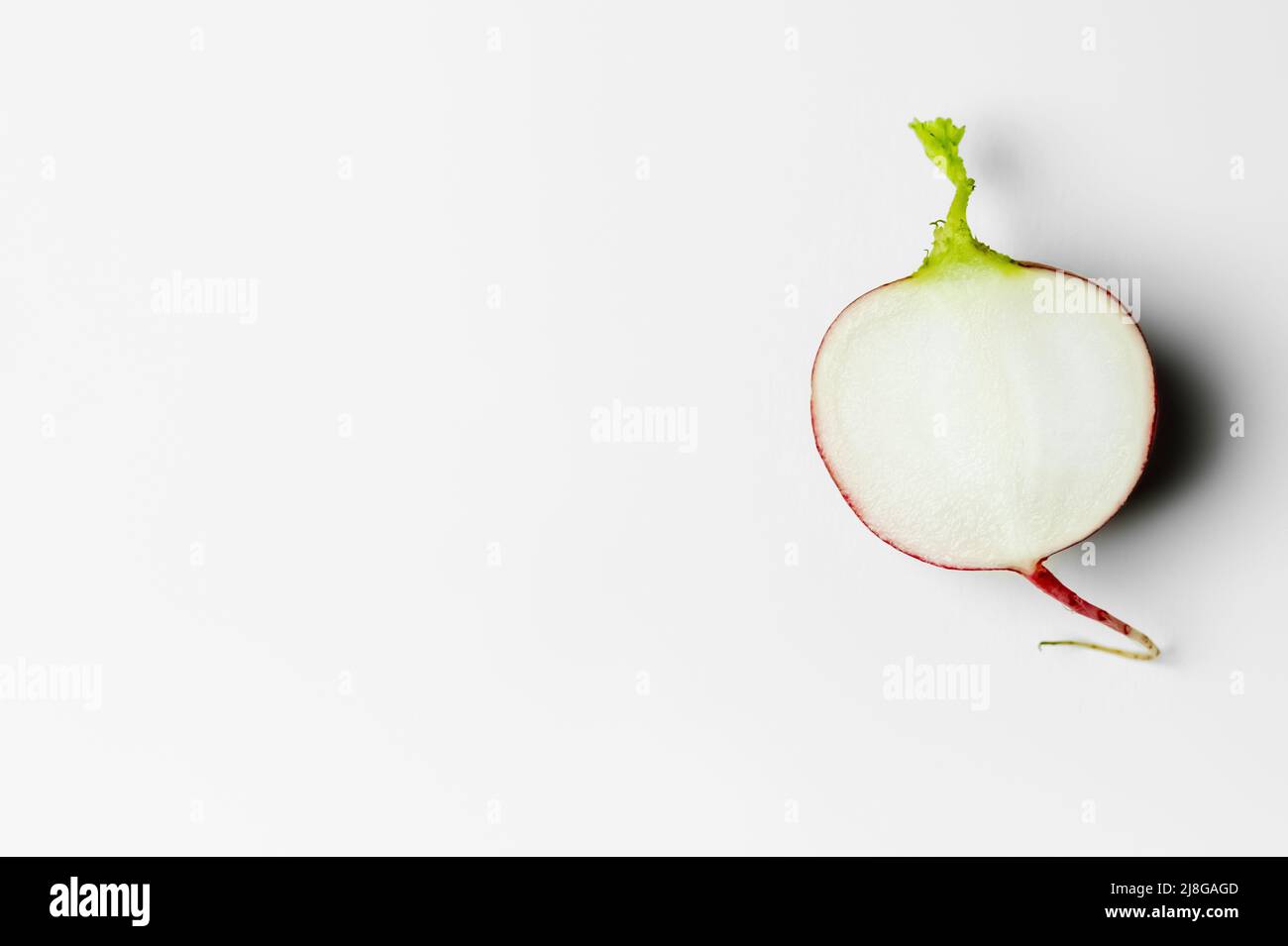 Top view of cut radish on white background with copy space Stock Photo ...