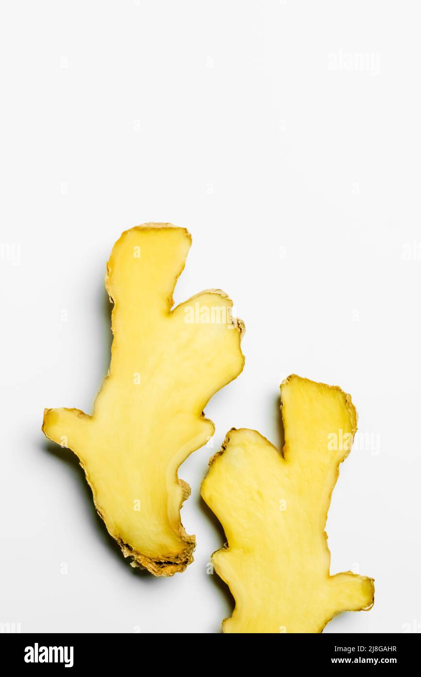 Top view of fresh cut ginger on white background Stock Photo - Alamy