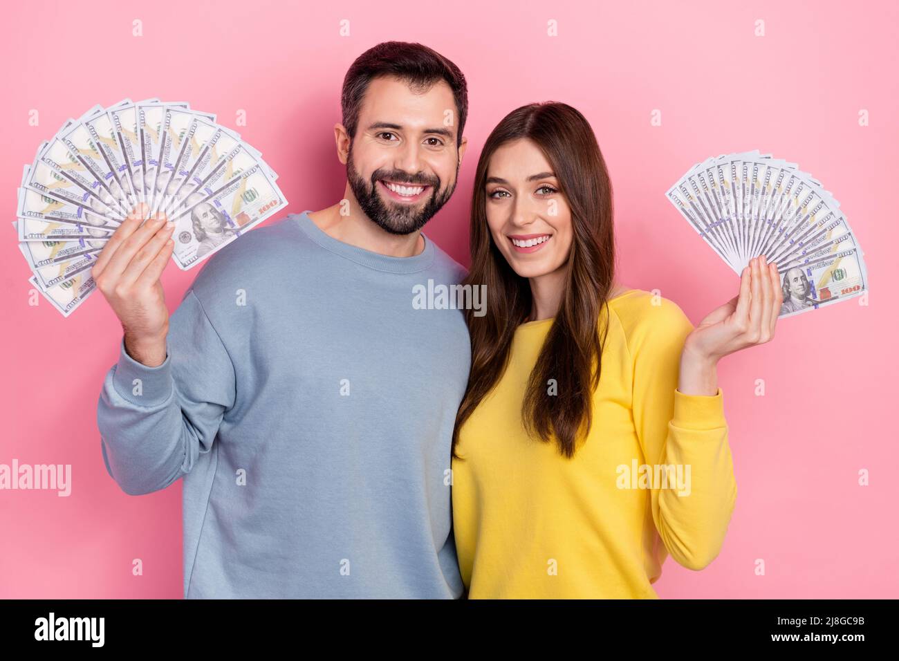 Portrait of beautiful handsome friends friendship holding cash budget ...