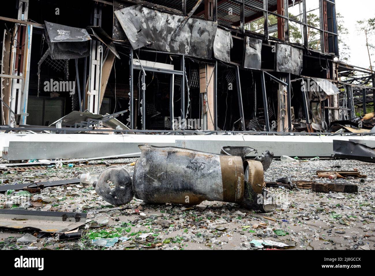 Piece of a Russian Grad rocket (cylindrical item in the center lower ...