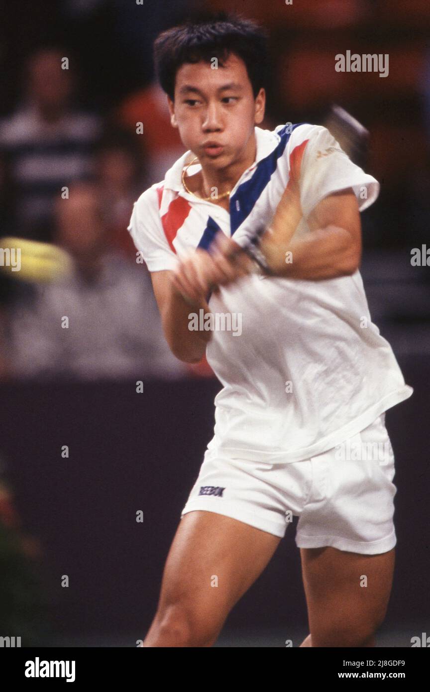 Michael Chang plays a two-handed backhand shot at the Silk Cut ...
