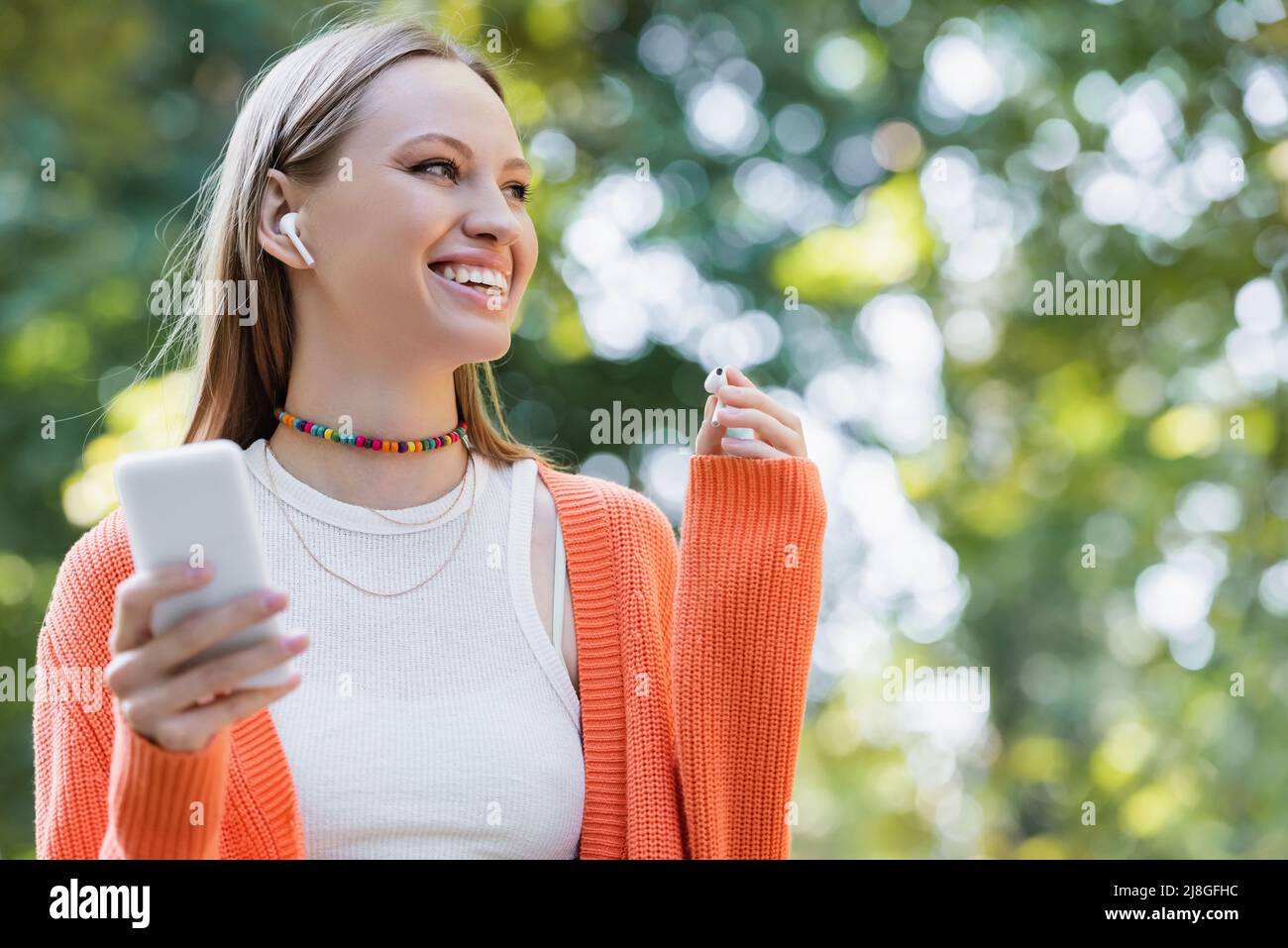 Person using remote wireless hi-res stock photography and images - Alamy