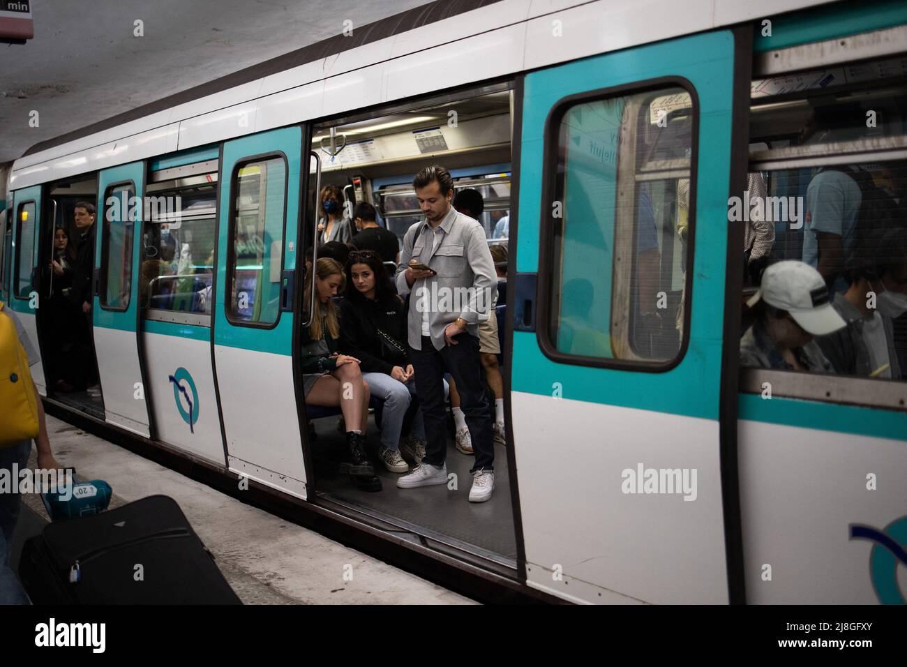 People take the Metro without face mask in Paris on May 16, 2022. As ...