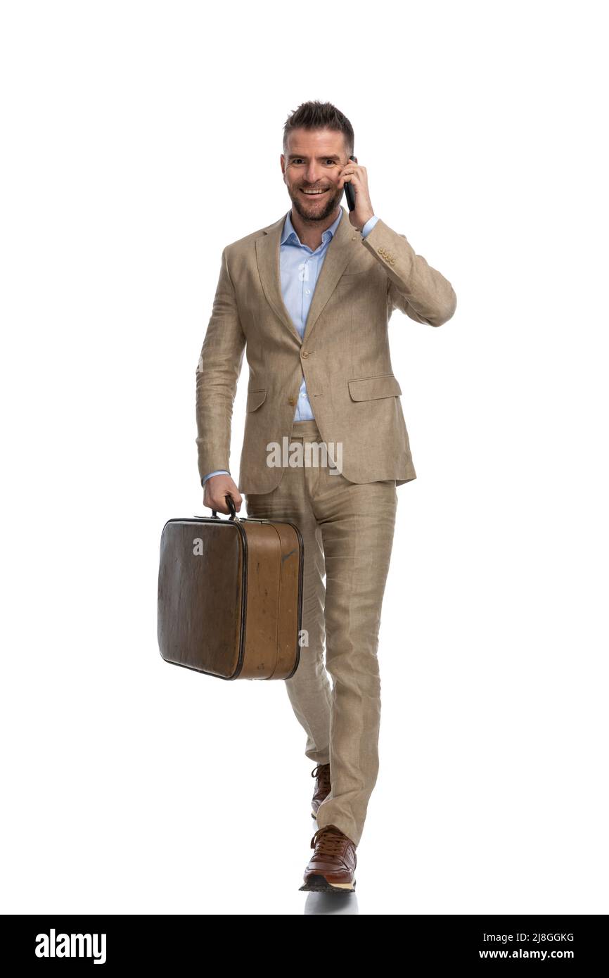 full body picture of attractive young man having a conversation on the ...