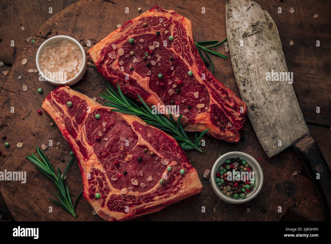 aesthetic picture of red beef steak with sprinkles of salt and pepper ...