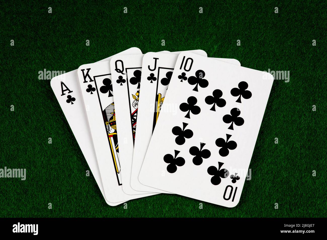 Playing card hand laid on a green felt card table Stock Photo - Alamy