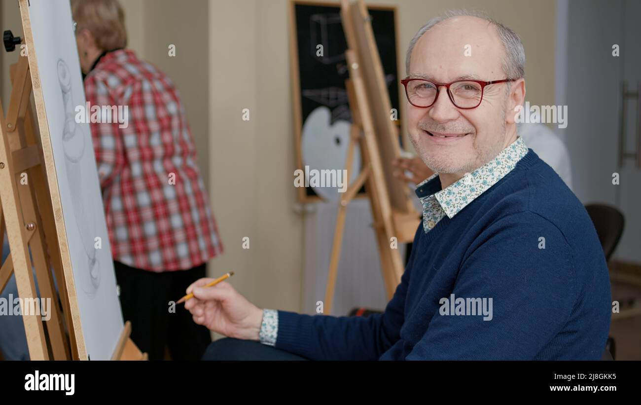 Portrait senior man attending drawing hi-res stock photography and ...