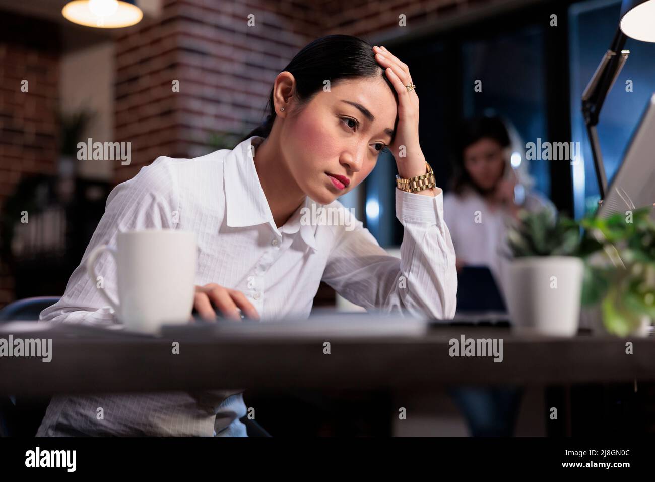 Exhausted manager with burnout syndrome analyzing marketing strategy of ...