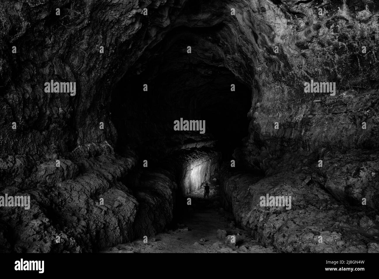 Little Man, Big Hole Stock Photo - Alamy