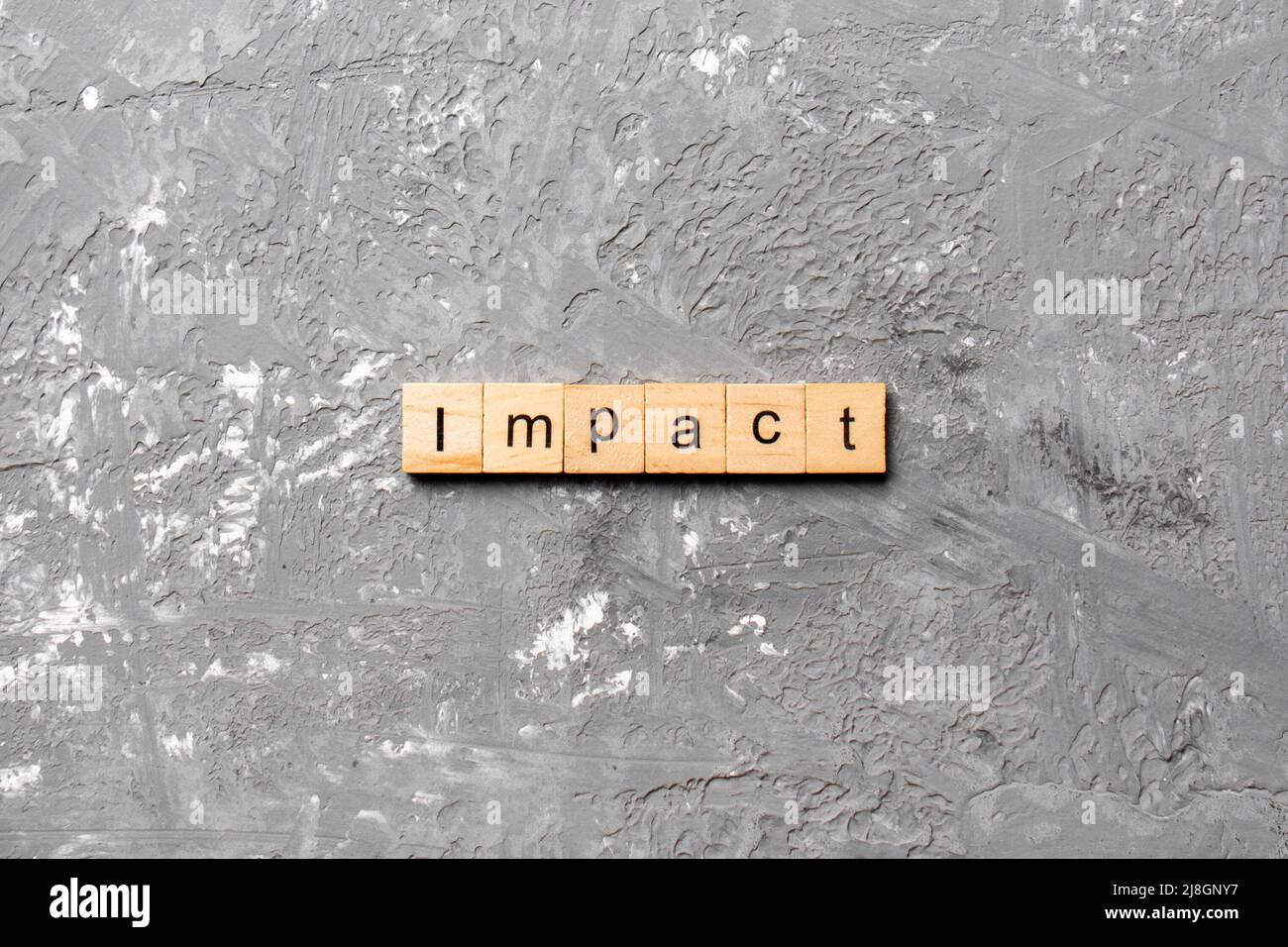 impact word written on wood block. impact text on table, concept Stock ...
