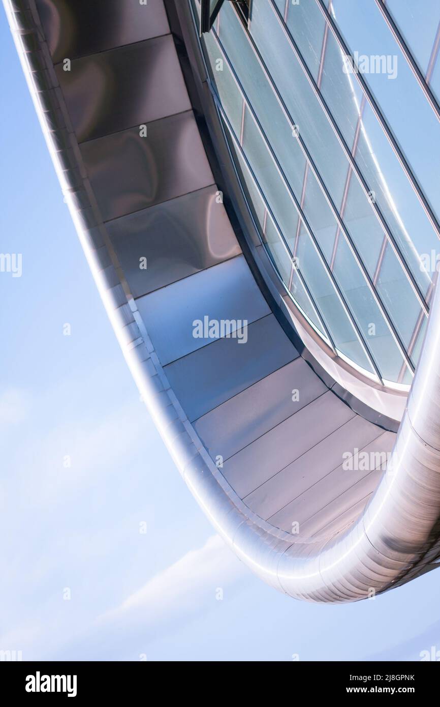 Part of a modern building. Oval shaped futuristic building built with ...