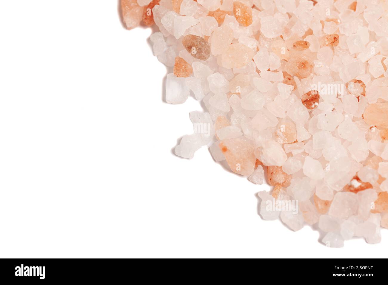Heap of large crystals pink Himalayan salt isolated on white background ...