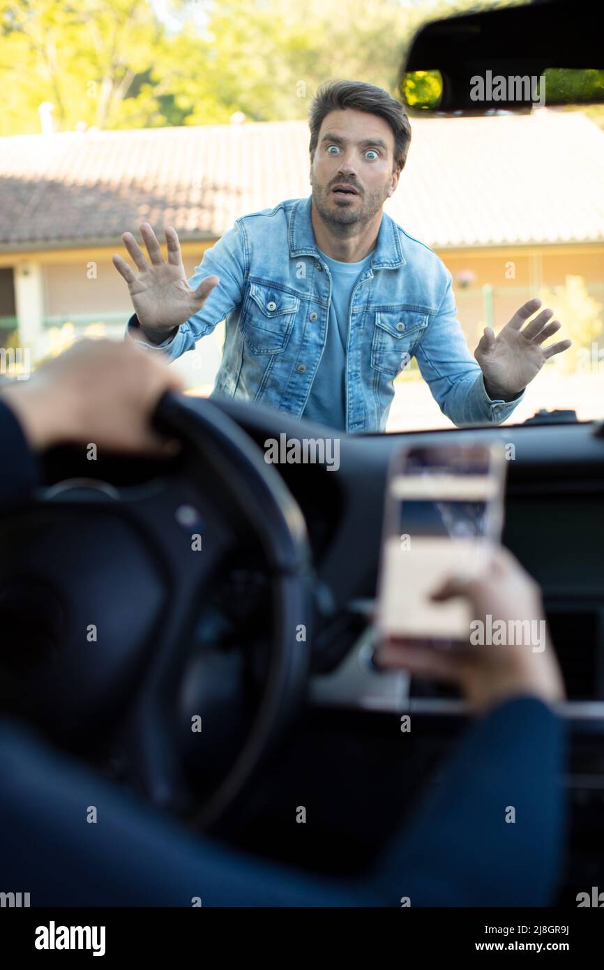 mature man about to be rolled over by a car Stock Photo - Alamy