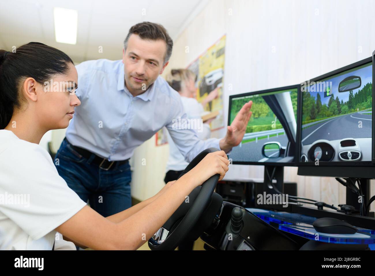 young woman using driving simulator Stock Photo - Alamy