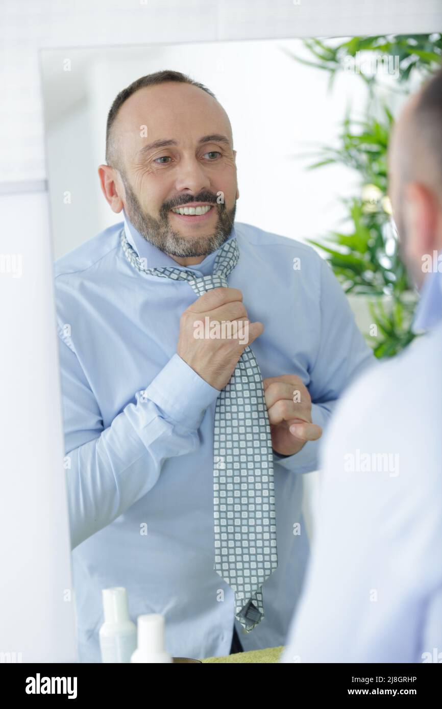 man in front of a mirror in room Stock Photo - Alamy